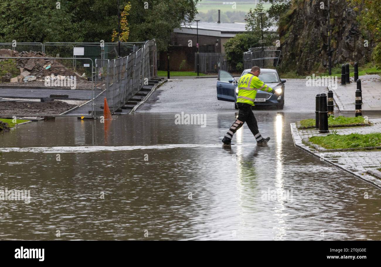 A AA partrol helps rescue a car from floodwater in Dumbarton, West ...