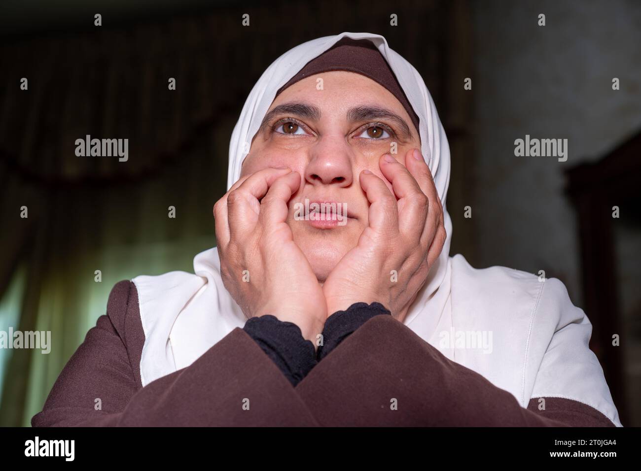 female wearing hijab have faith and serenity expression on her face ...