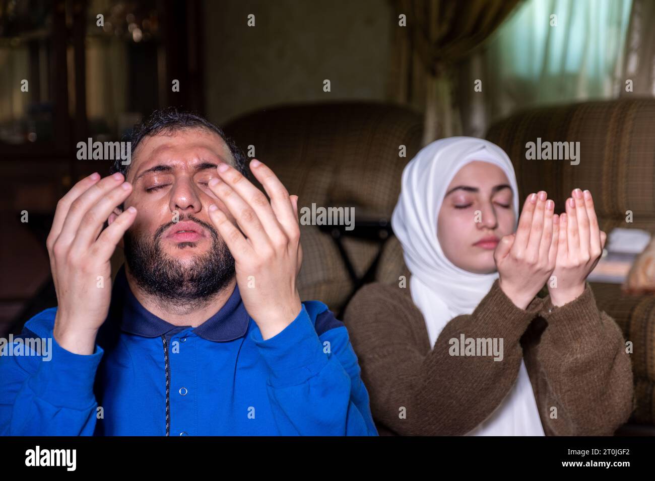 muslim couples praying together asking allah for mercy and forgiveness ...