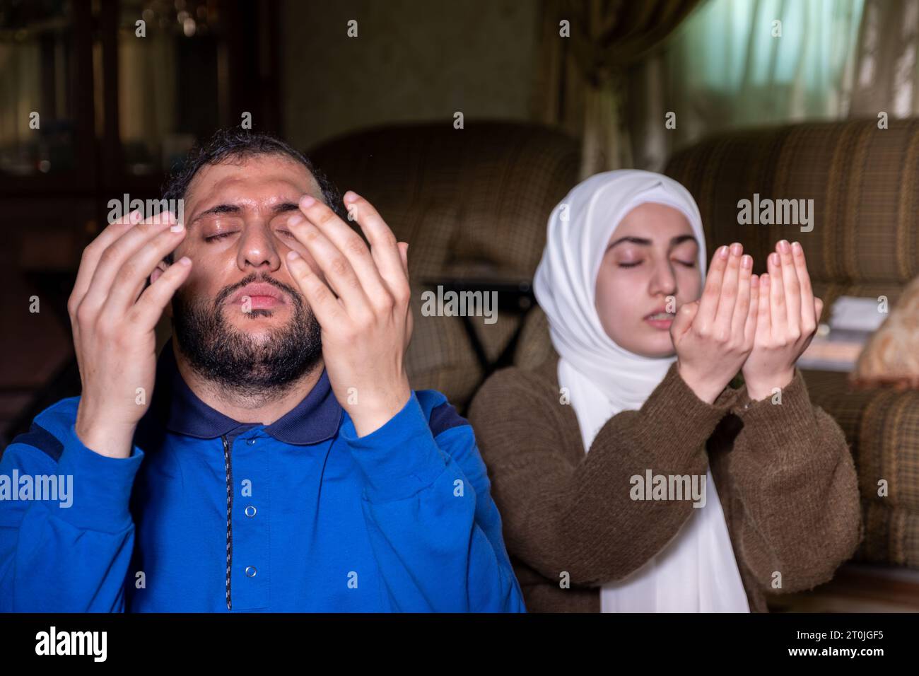 muslim couples praying together asking allah for mercy and forgiveness ...