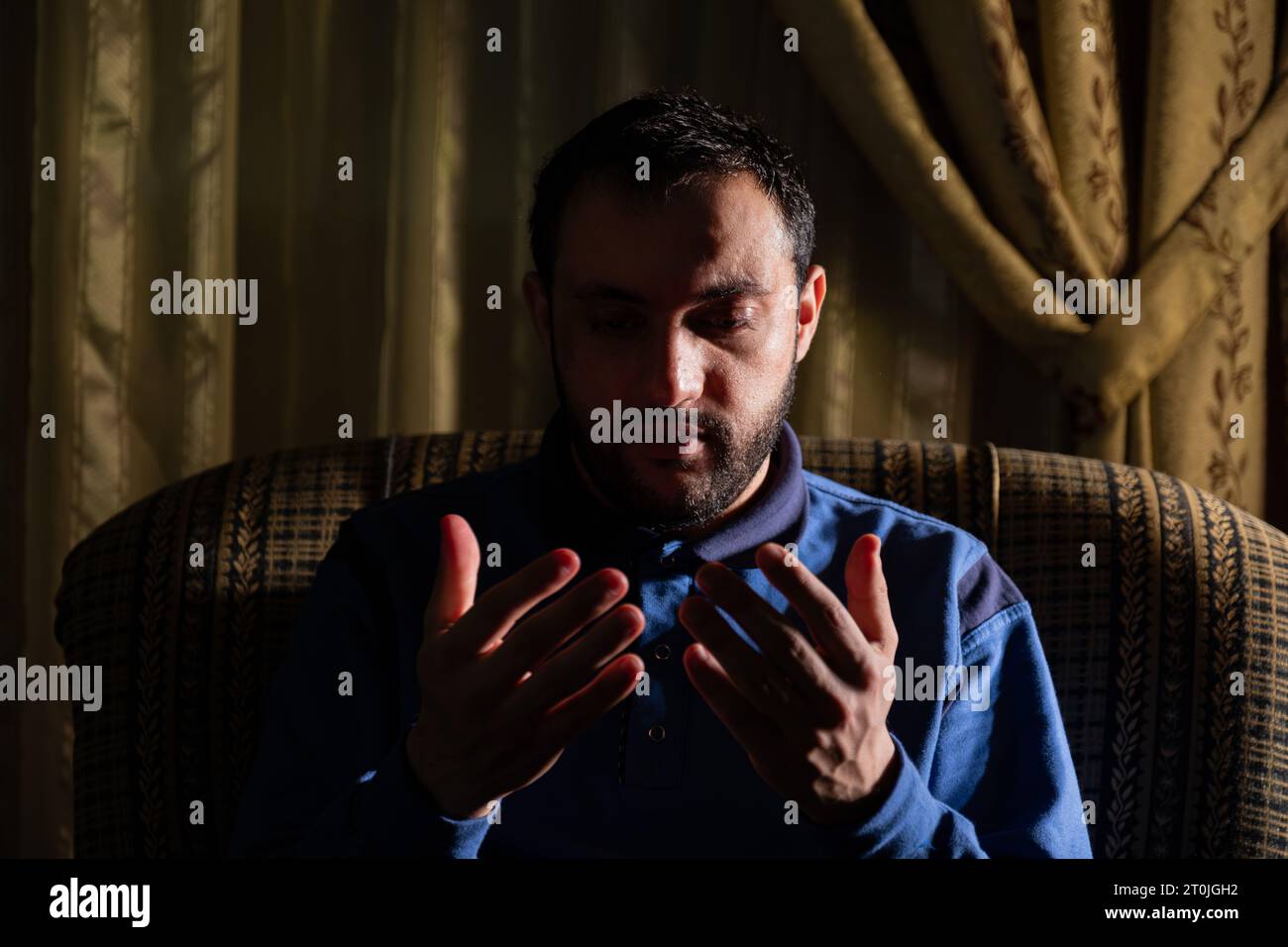 muslim male rising his hands to pray for allah and asking for ...