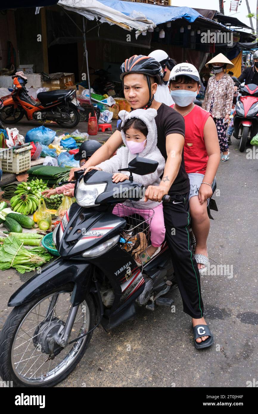 Hoi An, Vietnam. Family Riding on Motorbike, No Helmets for Children ...