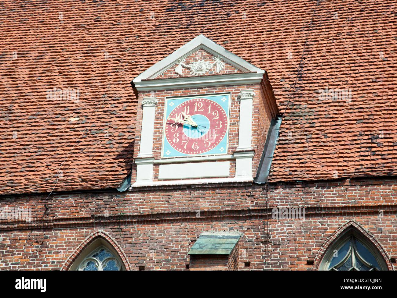 The close view of historic medieval castle clock in Frombork town ...