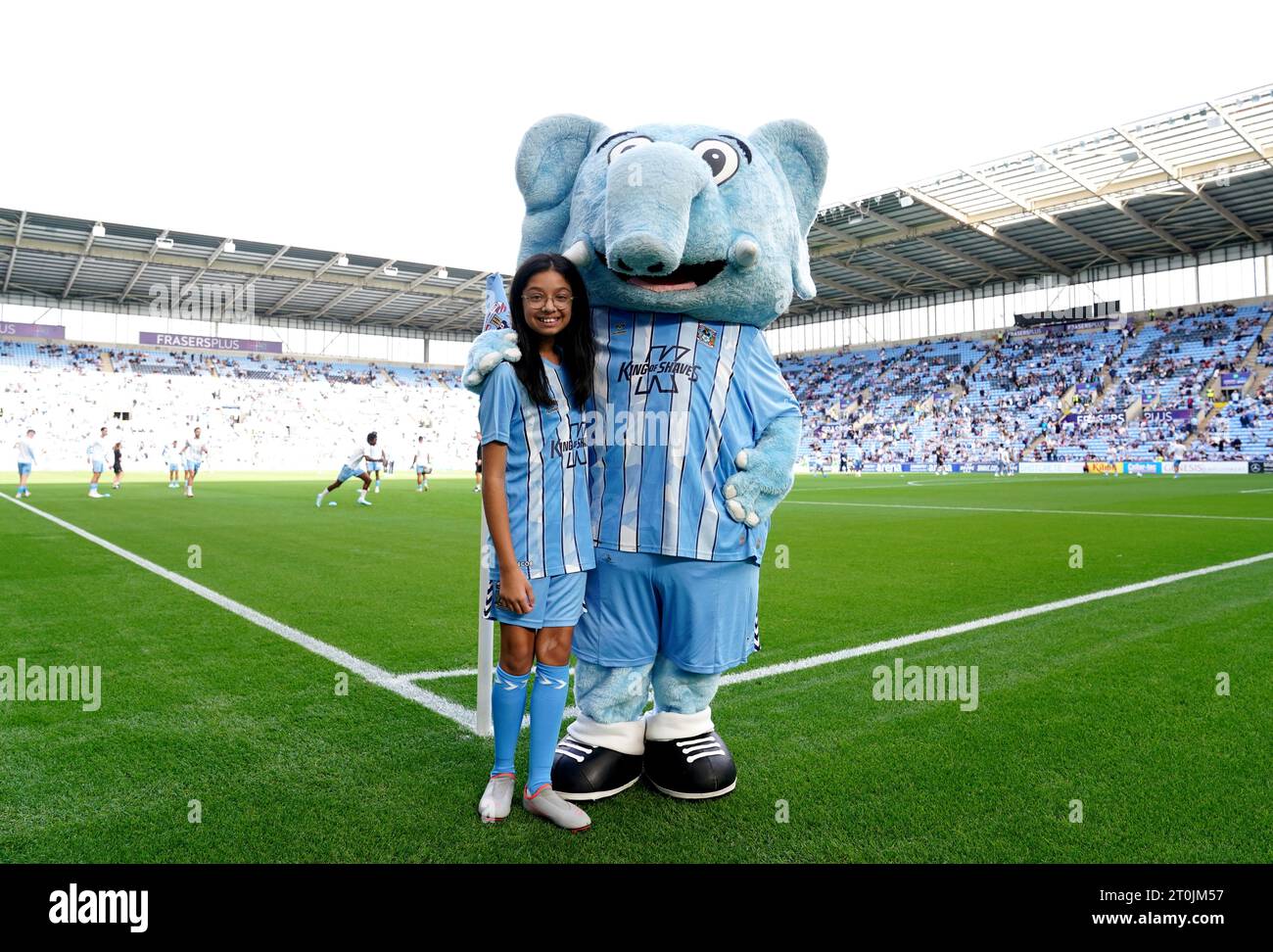 A Coventry City match day mascot poses for a photo with Sky Blue Sam ...