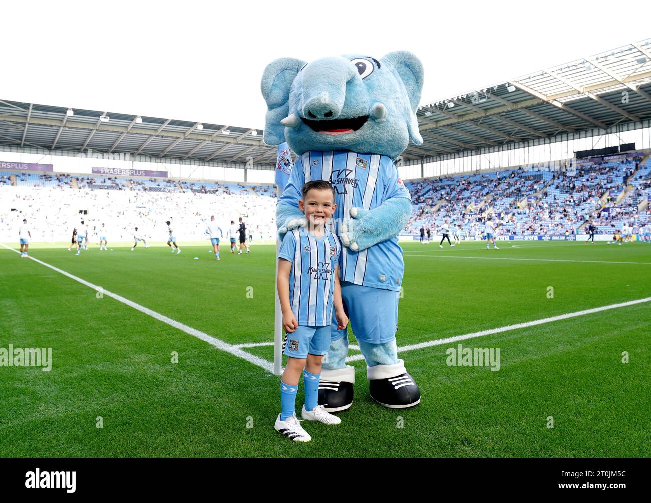 A Coventry City match day mascot poses for a photo with Sky Blue Sam ...