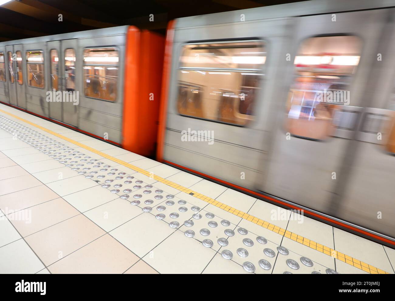 Subway car running fast in the underground station Stock Photo - Alamy