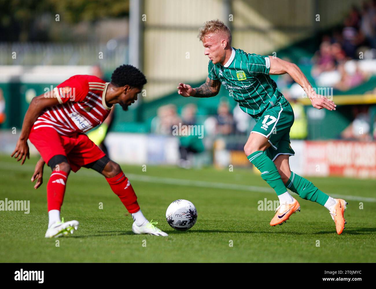Will Dawes of Yeovil Town and Jason Ring of Aveley Town during the ...