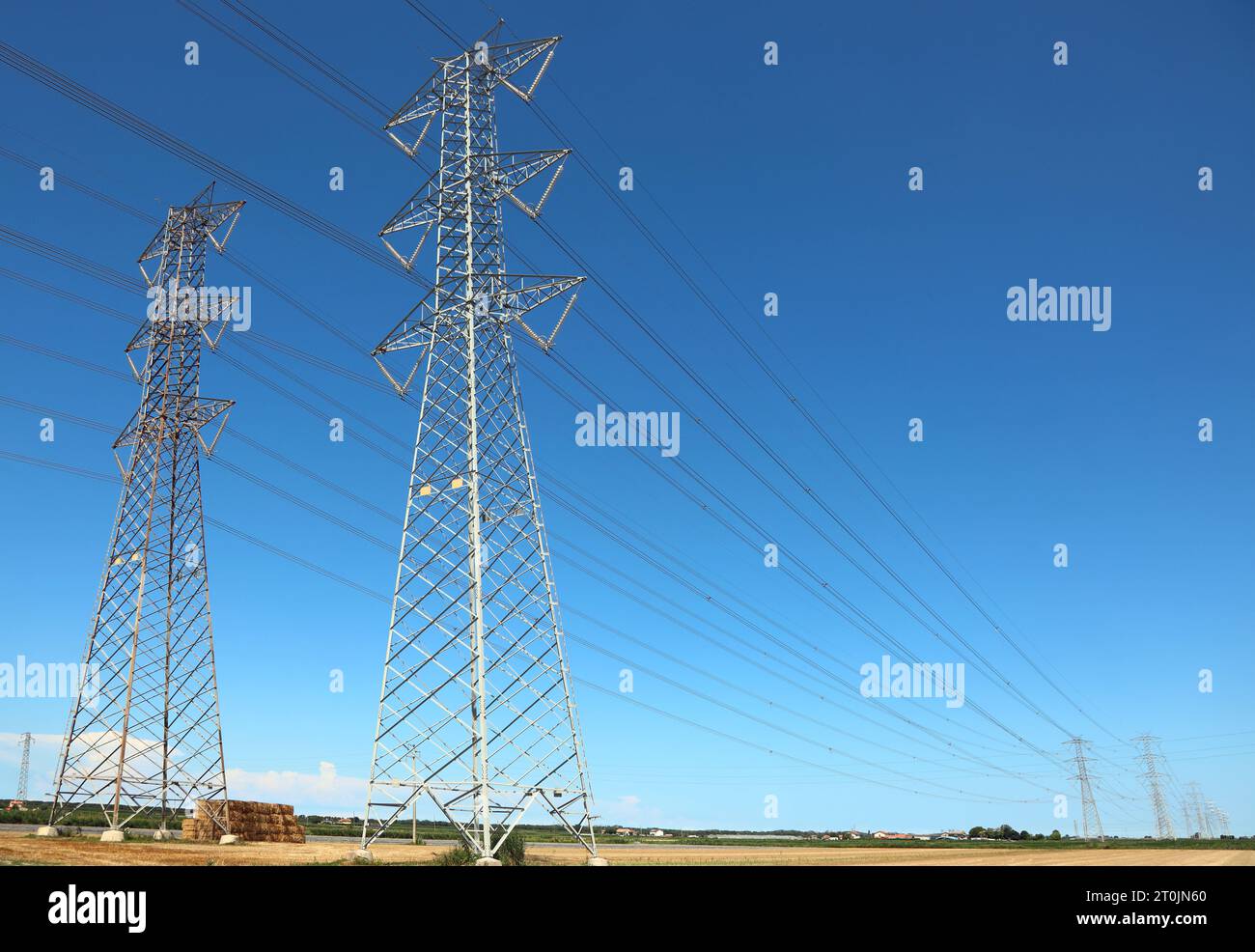 large pylons with high voltage cables that transport electricity from ...