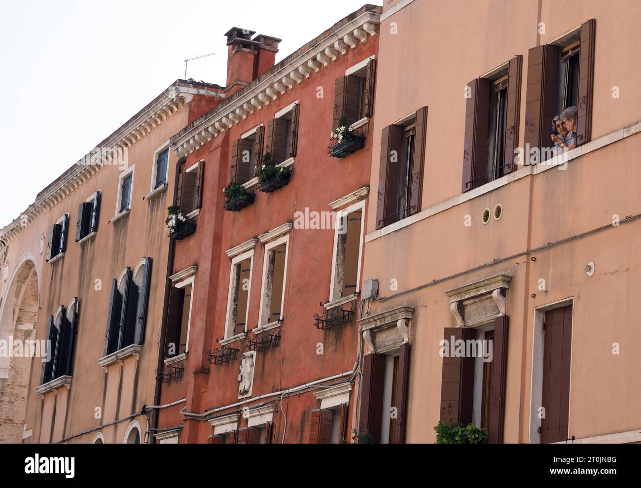 Scenes of Venice, Italy on October 7, 2023. Residents look out of a ...