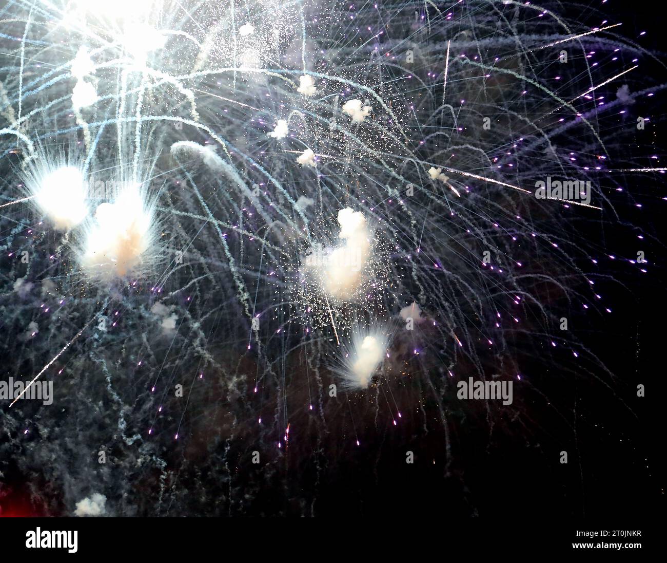 many sparkling glittering fireworks exploded in the sky during the ...