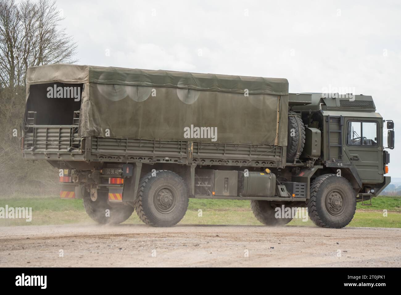 British army MAN SV 4x4 Medium Utility truck driving along a dusty ...