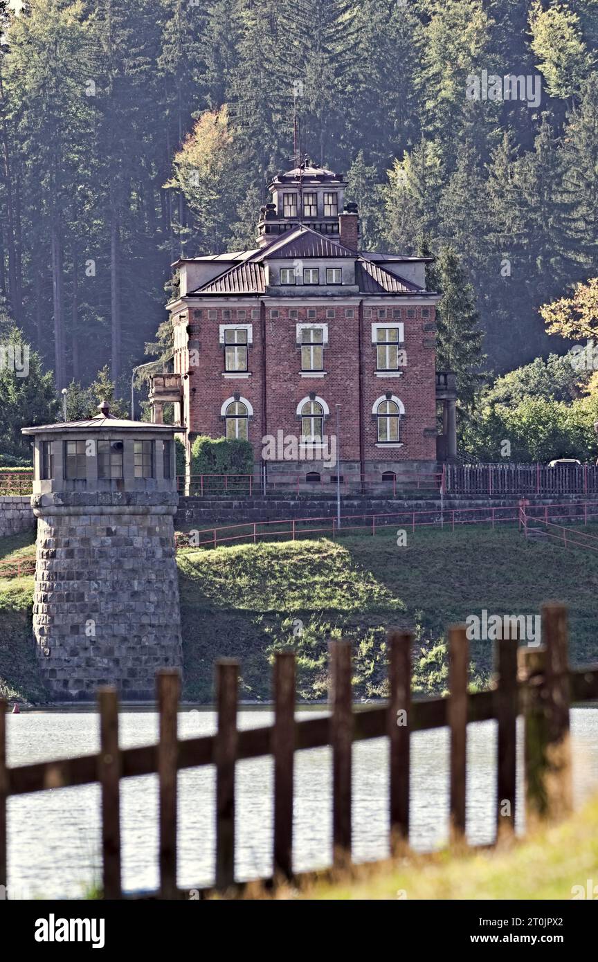 Technical engineering building on the dam wall of water reservoir ...