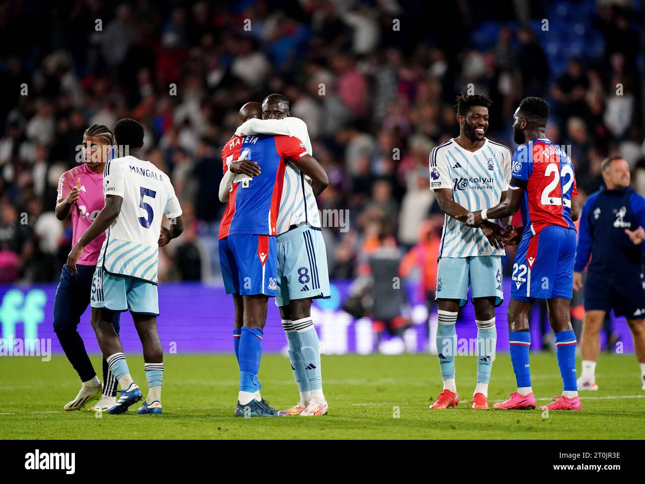 Players embrace and shake hands after the Premier League match at ...