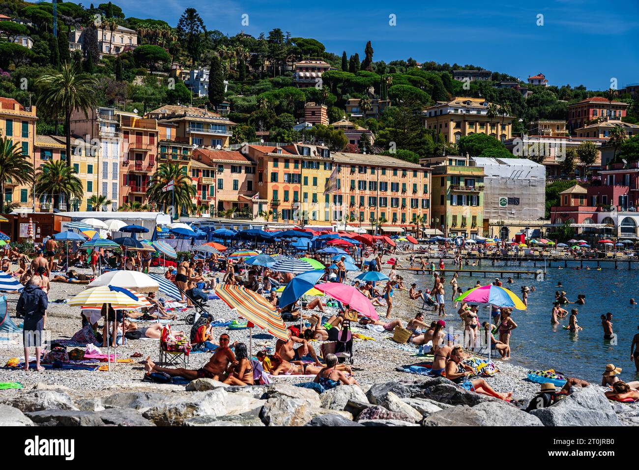 Sunbathers under umbrellas on the beautiful beach of Santa Margherita ...