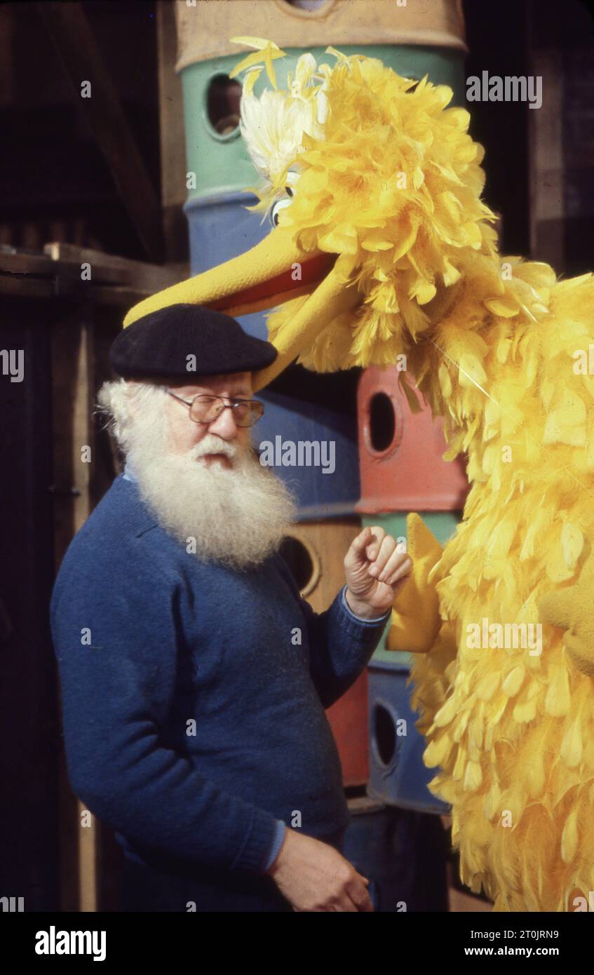 On A Break In Filming On The Sesame Street Set Big Bird Played By Carroll Spinney Grabs The Hat
