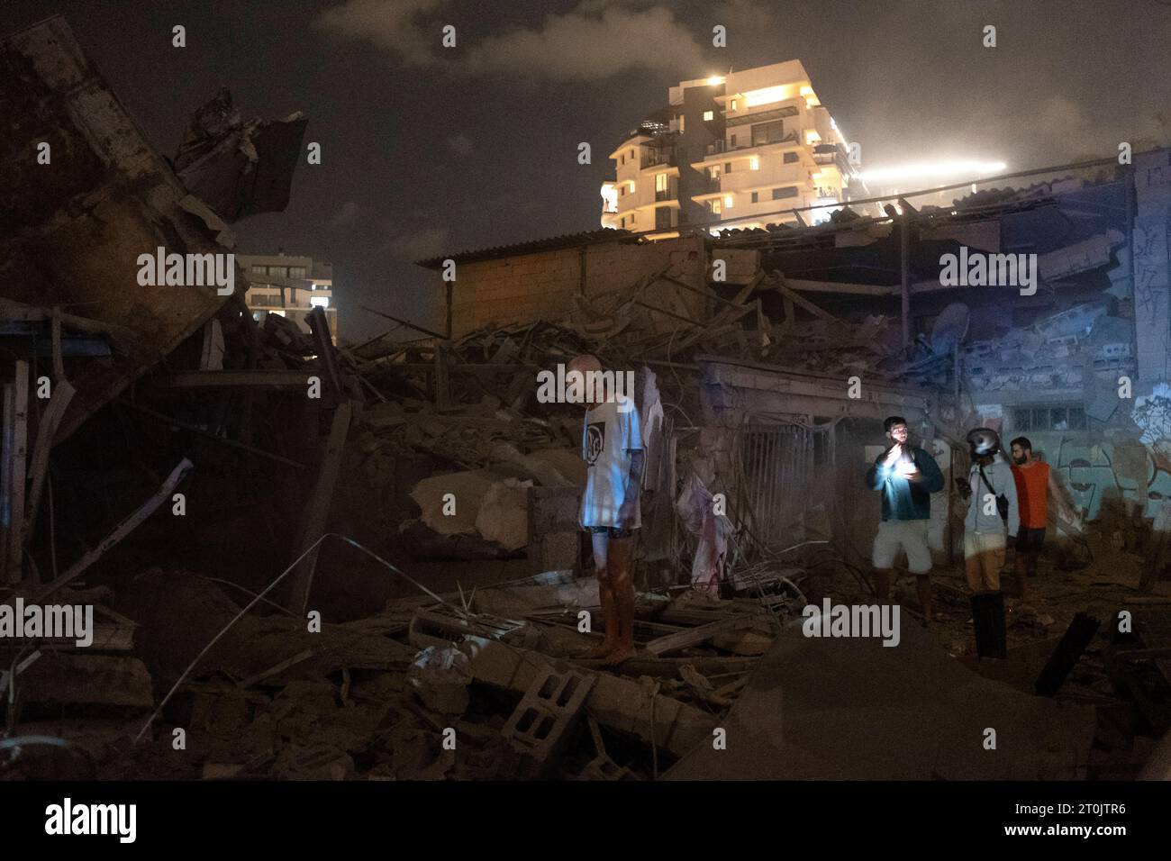 People look at the damage from a rocket fired from the Gaza Strip in ...