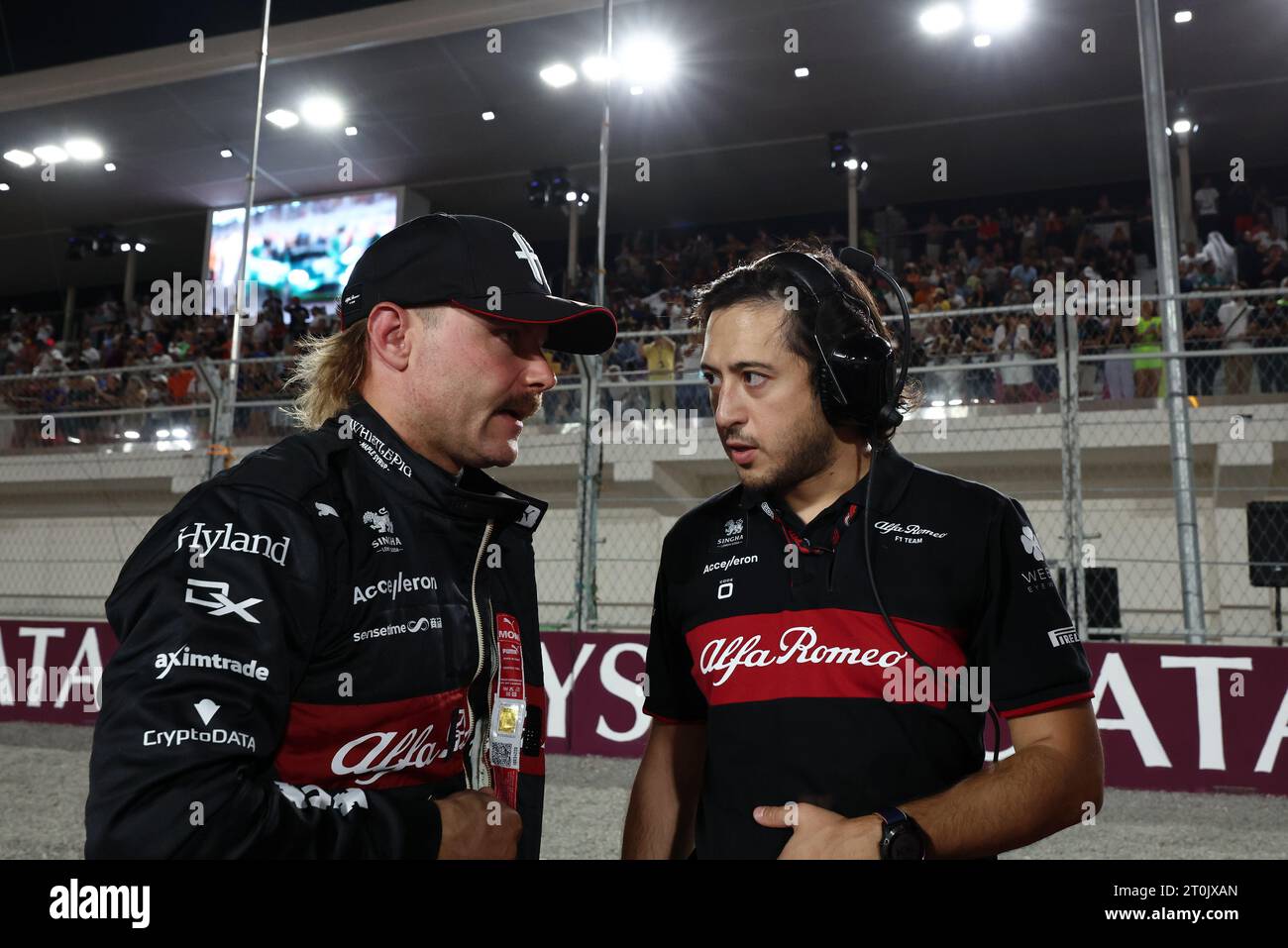 Doha, Qatar. 07th Oct, 2023. (L to R): Valtteri Bottas (FIN) Alfa Romeo F1 Team on the grid with ...