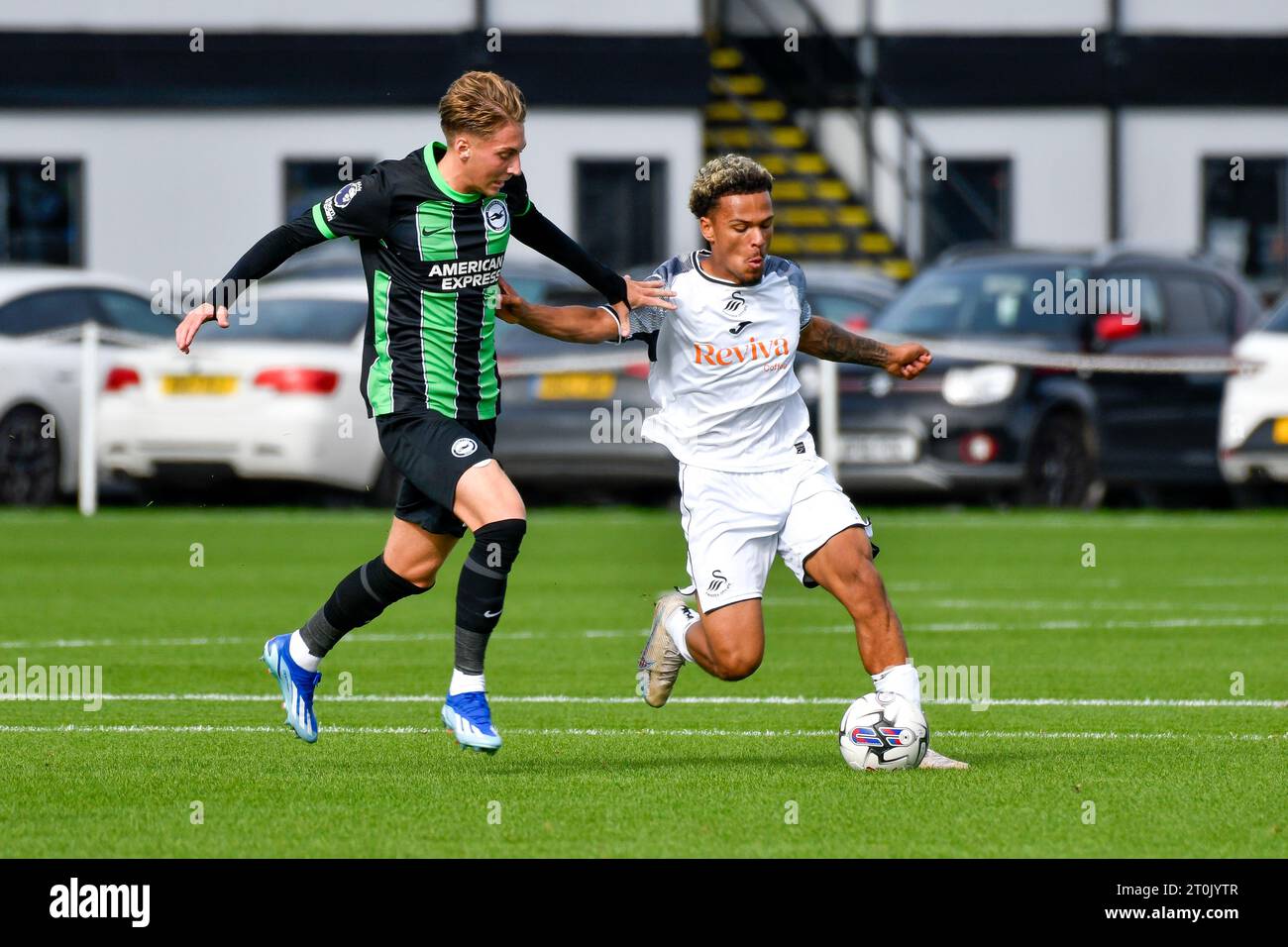 Swansea, Wales. 7 October 2023. Zane Myers of Swansea City holds off ...