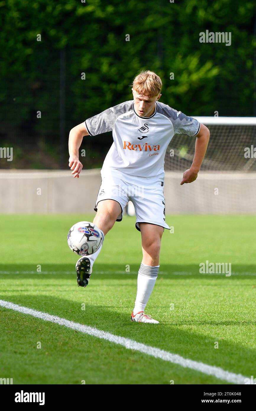 Swansea, Wales. 7 October 2023. Harry Jones of Swansea City controls ...