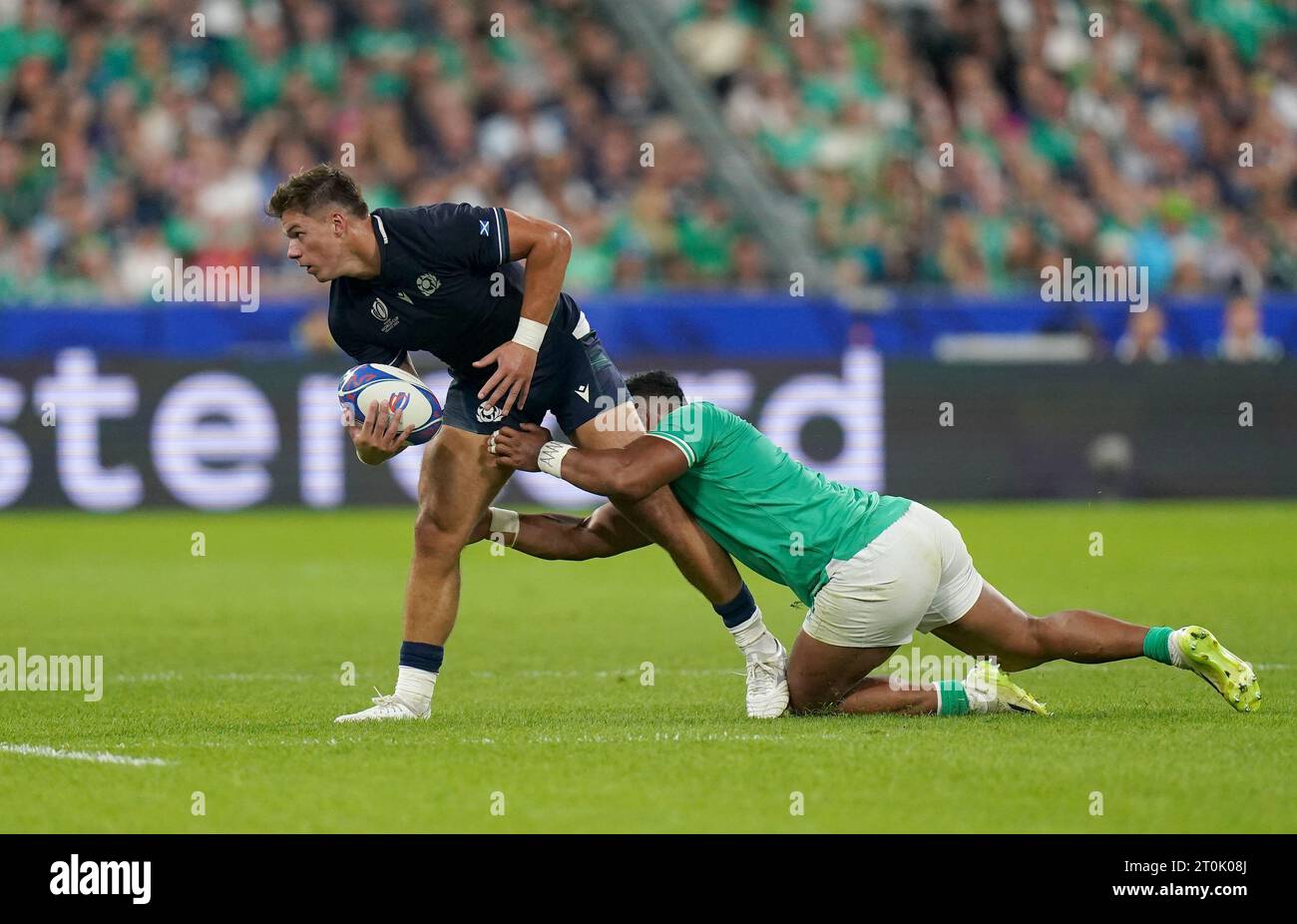 Scotland's Huw Jones (left) is tackled by Ireland's Bundee Aki during ...