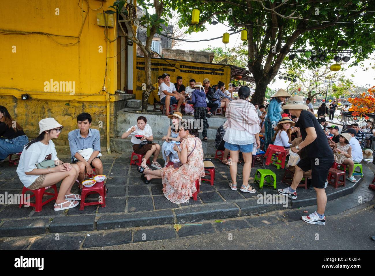 Hoi An, Vietnam. Tourists Having Breakfast at Street Corner Fast Food ...