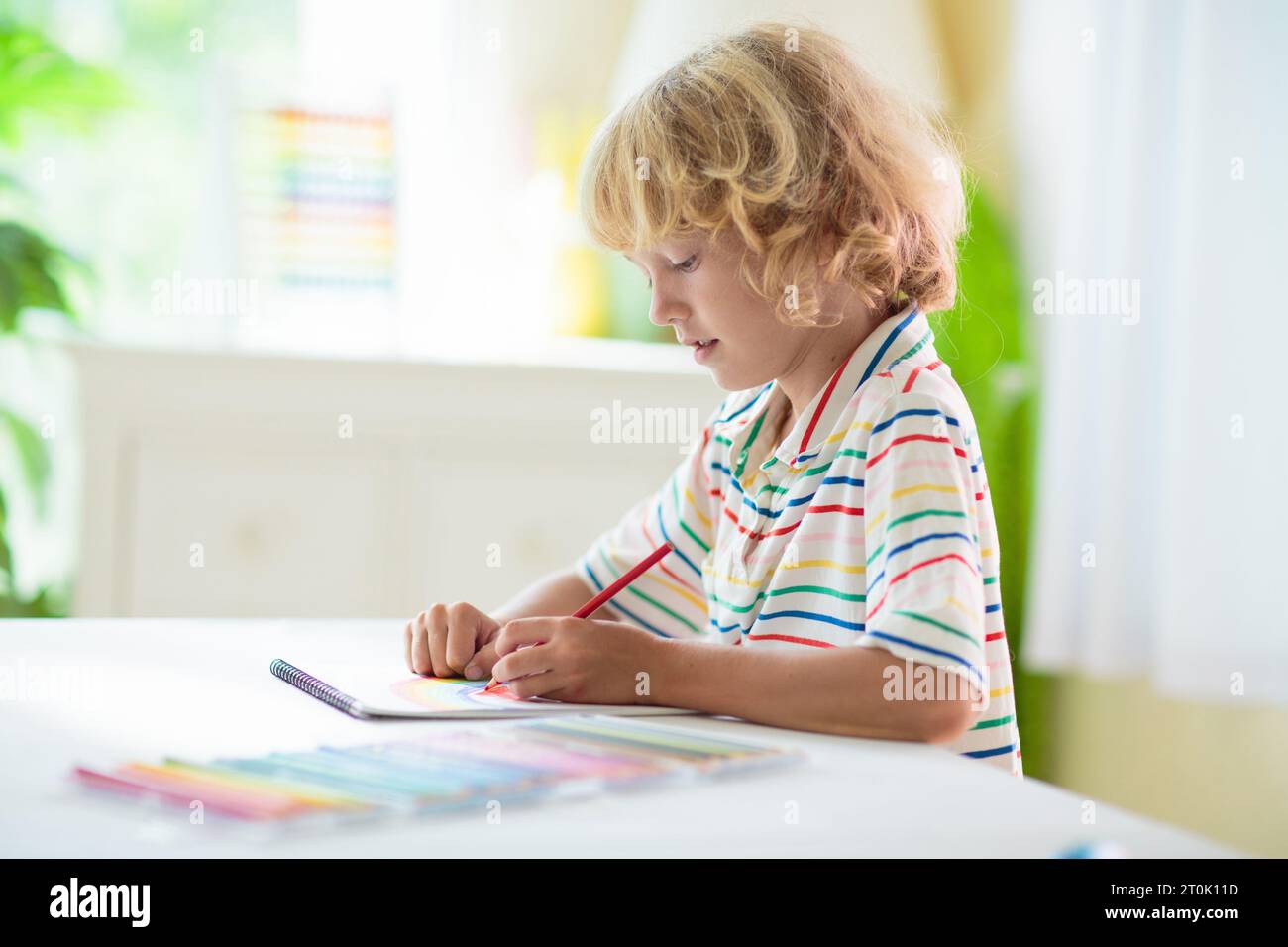Child drawing. School kid painting a picture. Little boy with colorful ...
