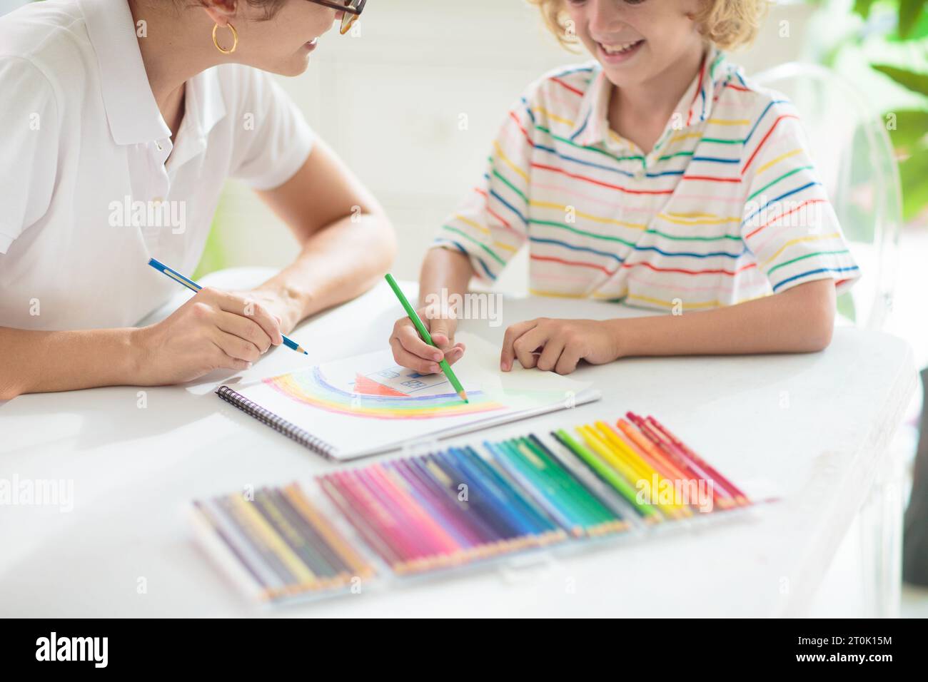 Child drawing. School kid painting a picture. Little boy with colorful ...