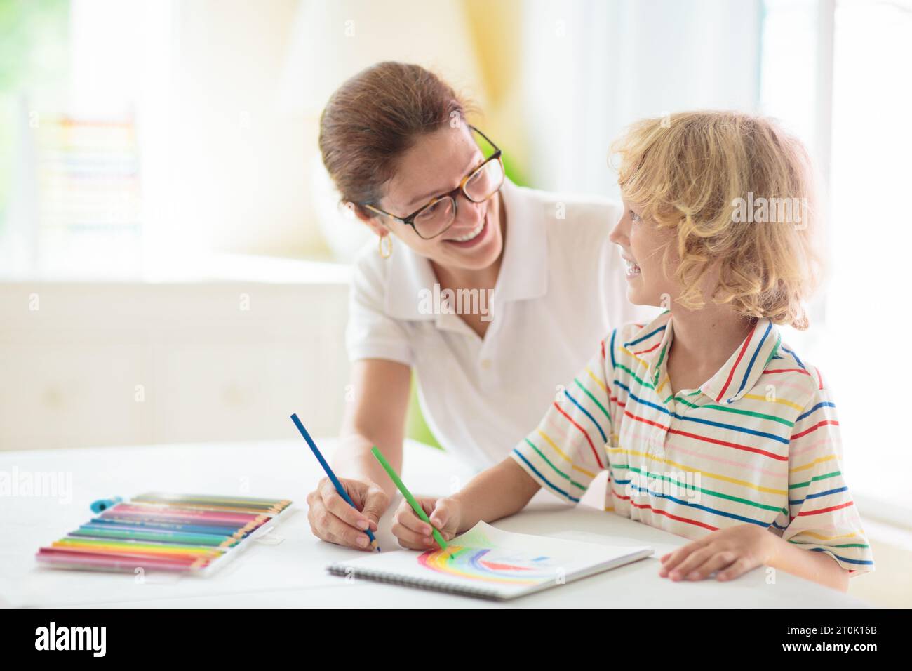 Child drawing. School kid painting a picture. Little boy with colorful ...