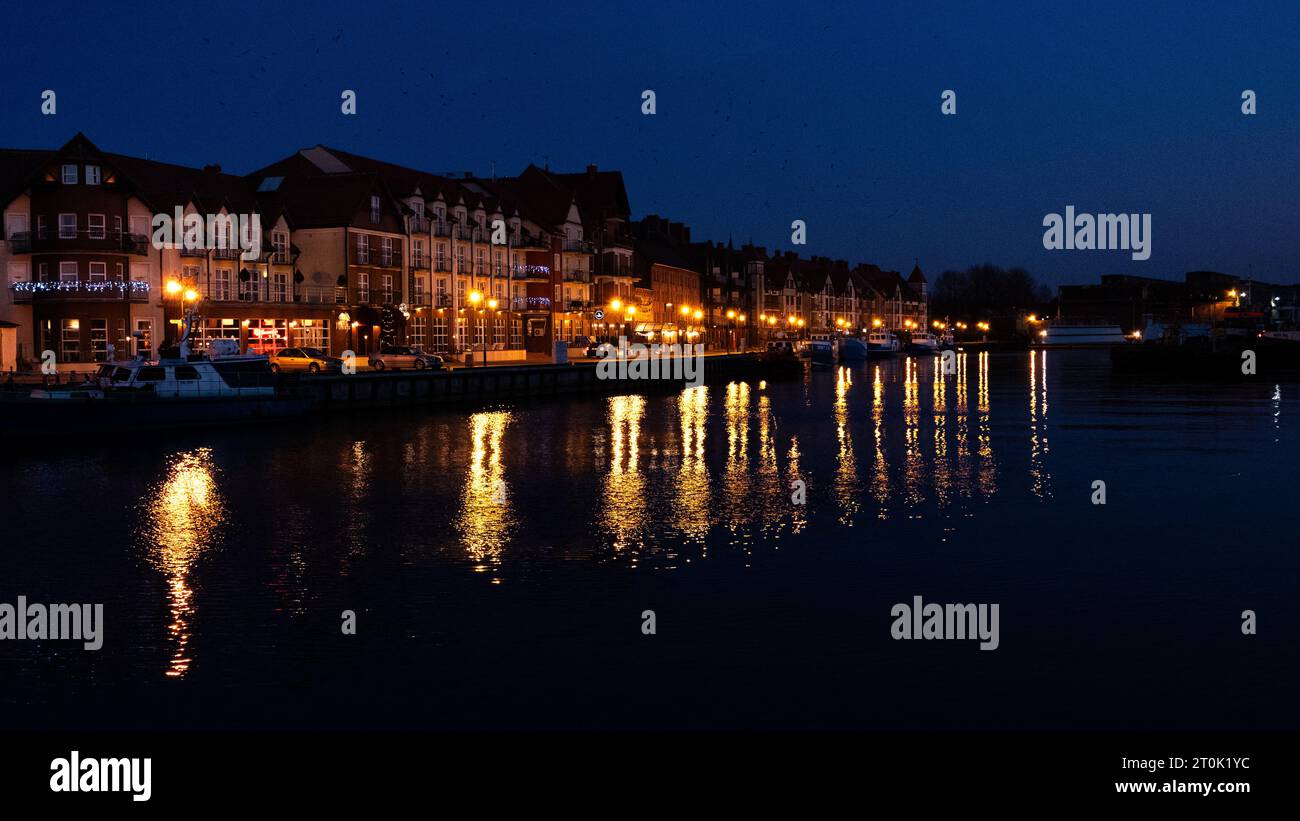 buildings in the harbor at night Stock Photo - Alamy