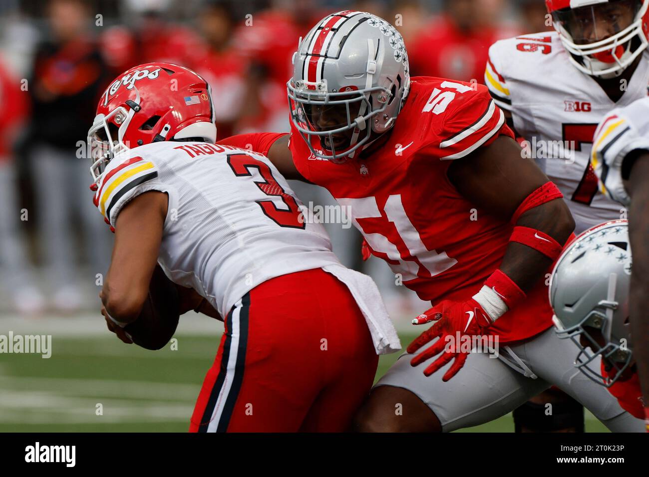 Ohio State defensive lineman Mike Hall, right, sacks Maryland ...