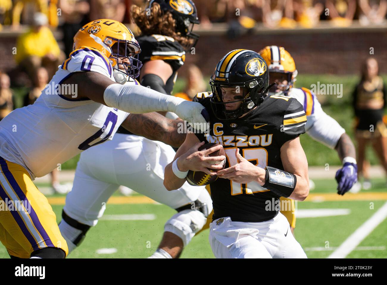 Missouri quarterback Brady Cook, right, is sacked by LSU defensive ...