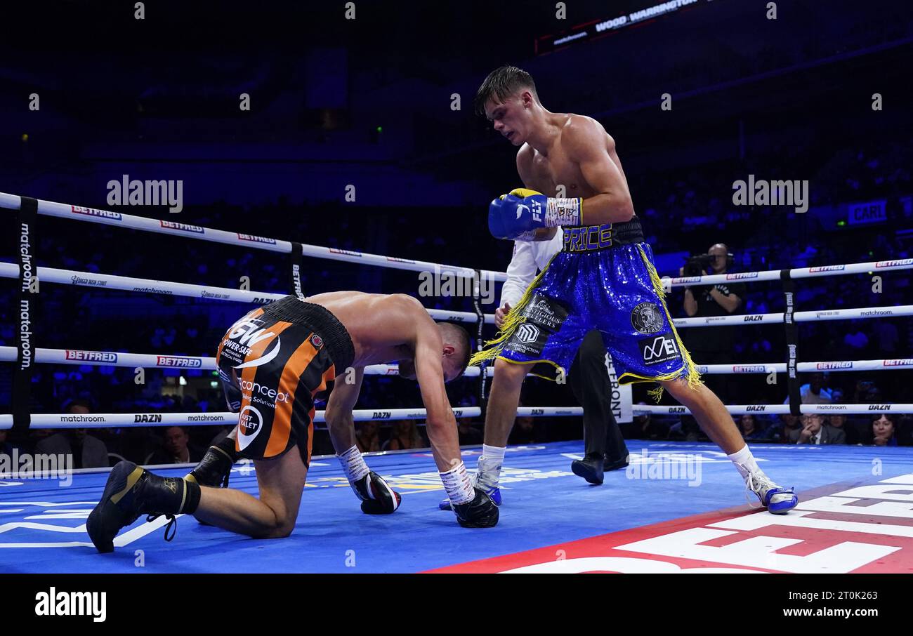 Hopey Price (right) knocks down Connor Coghill during their Final ...