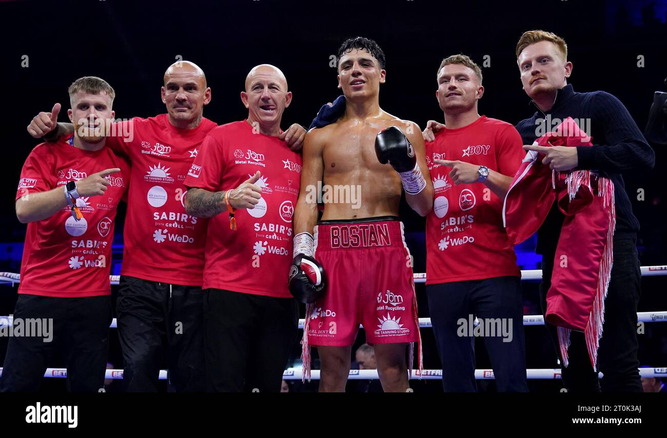 Junaid Bostan poses with his team following his victory over Corey ...