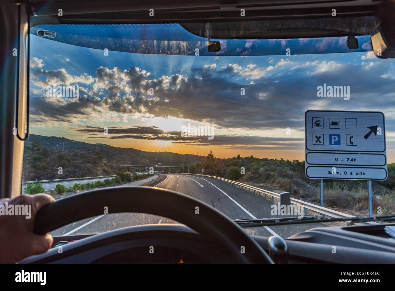View from the driving position of a truck of a highway with a 24-hour ...