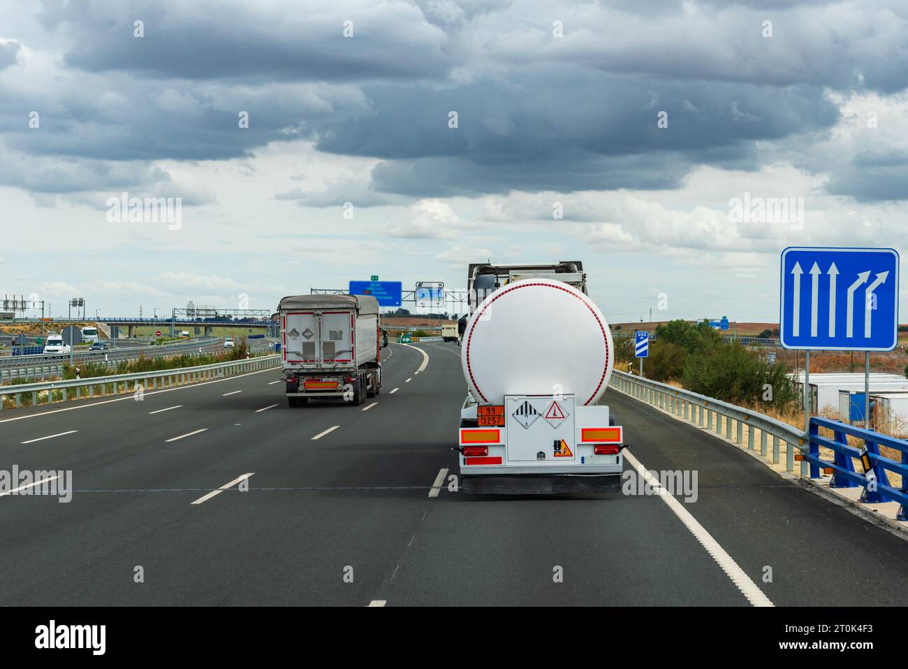 Trucks traveling on a five-lane highway in the same direction Stock ...