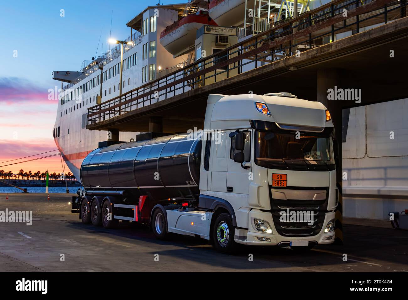 Fuel tanker truck waiting next to a ferry to refuel it Stock Photo - Alamy