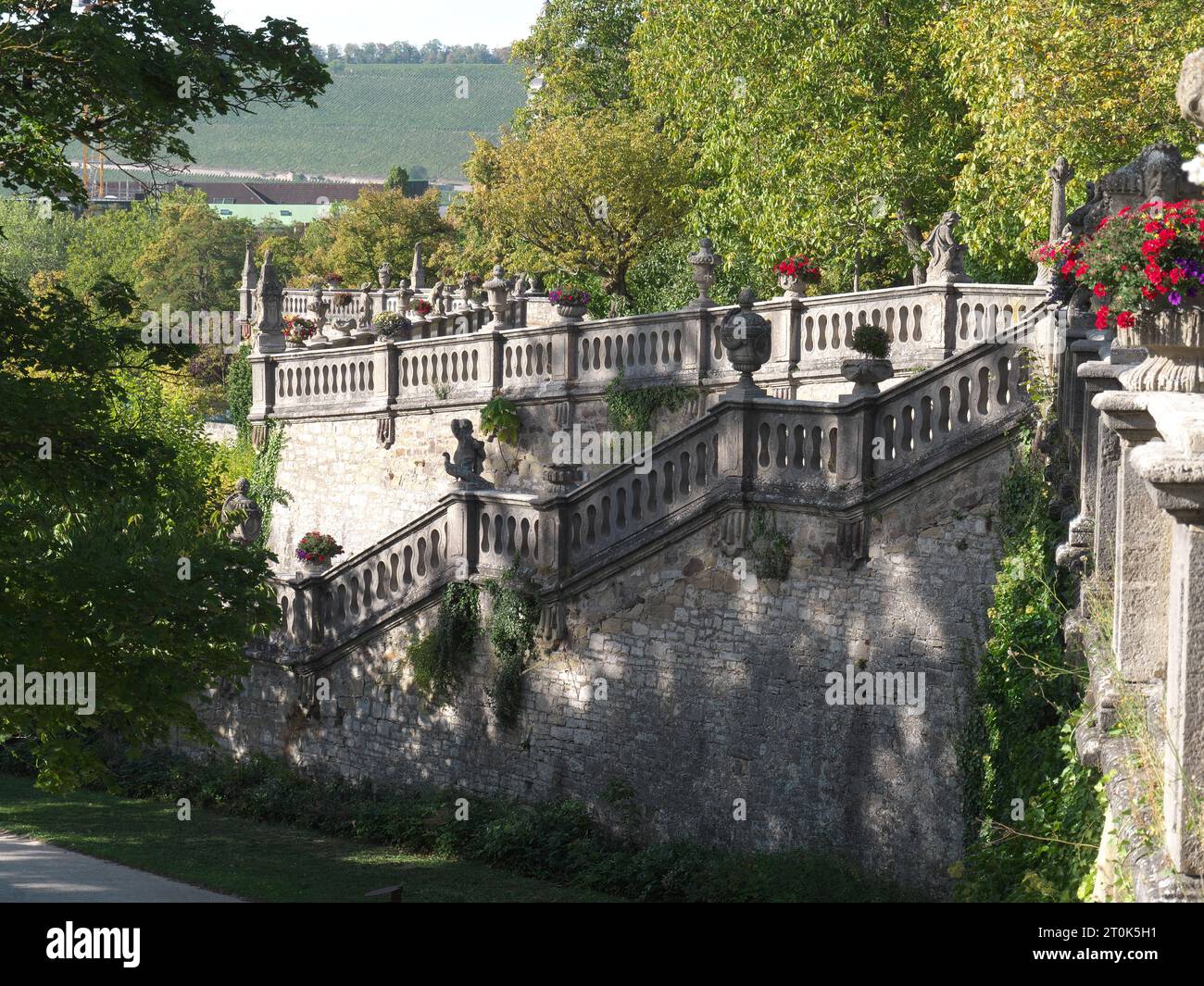Baroque balustrade with sandstone statues in the court garden in front ...