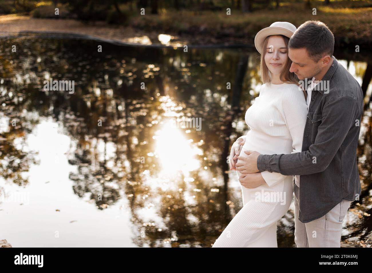 Family day. Stylish marriage pregnant couple waiting for baby. Man is ...
