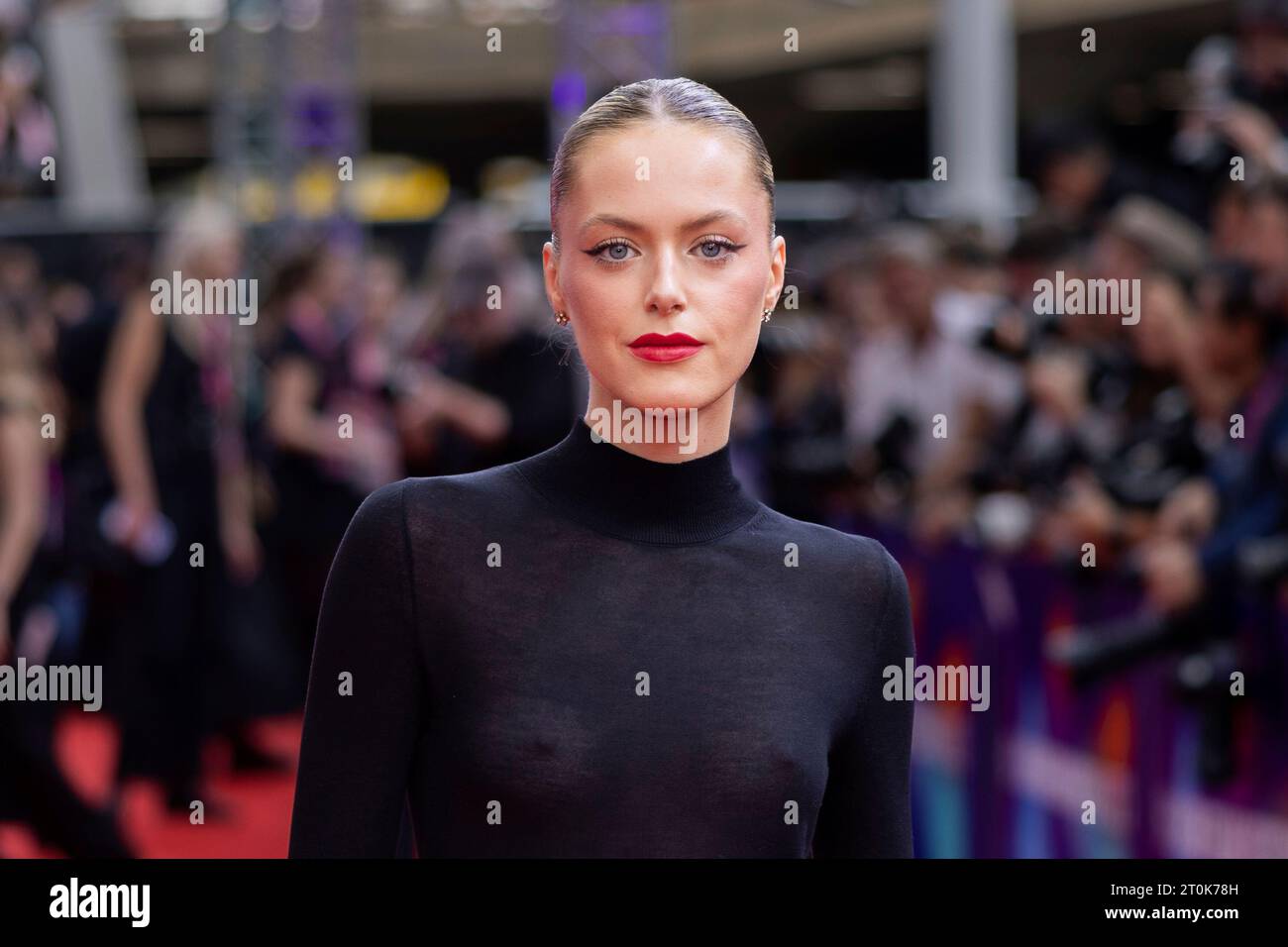 Madie PLT poses for photographers upon arrival for the premiere of the film 'Killers of the ...