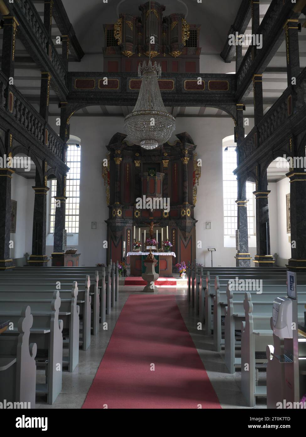 Baroque altar in the two-story interior of a church in Maroldsweisach ...