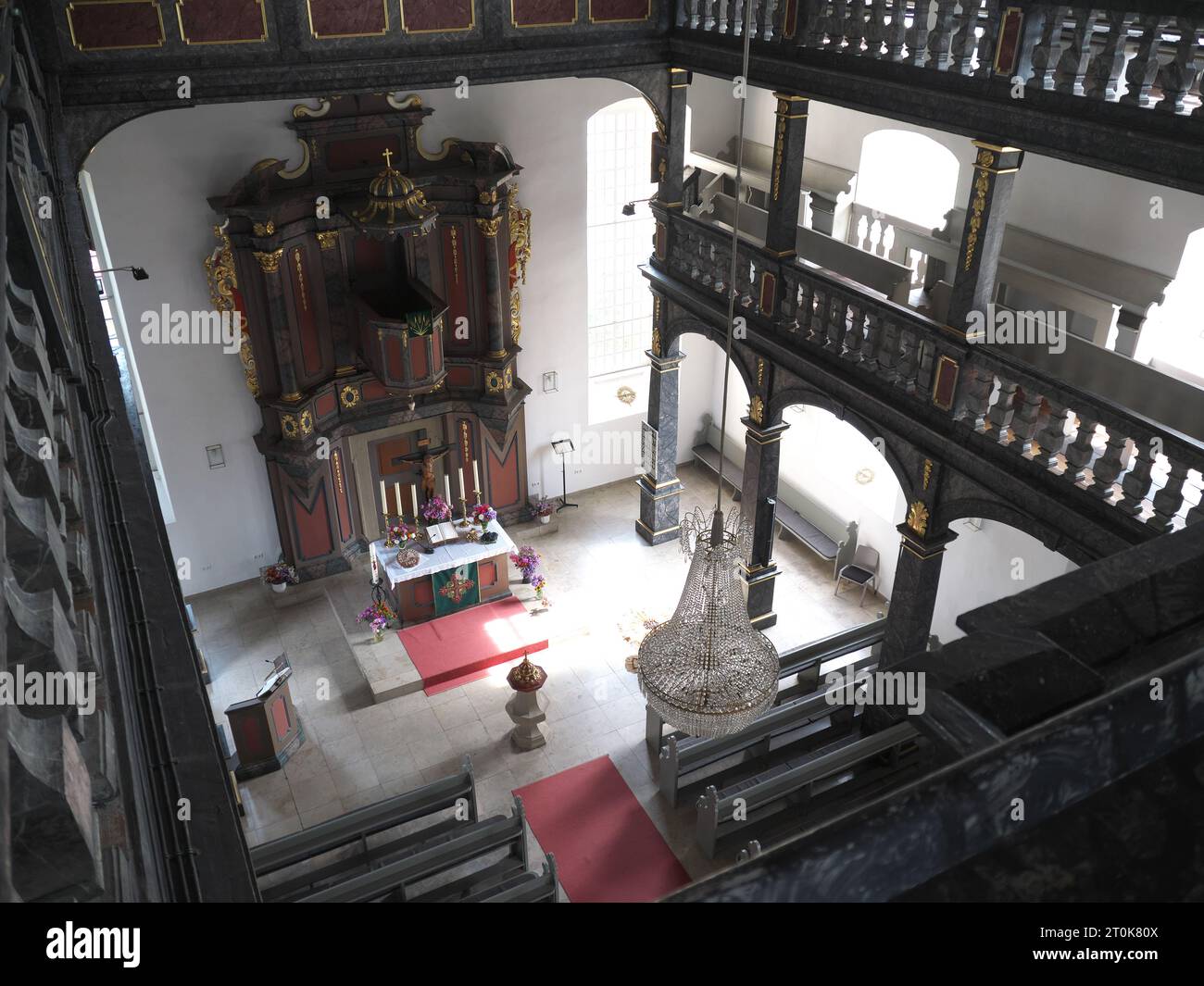 Baroque altar in the two-story interior of a church in Maroldsweisach ...