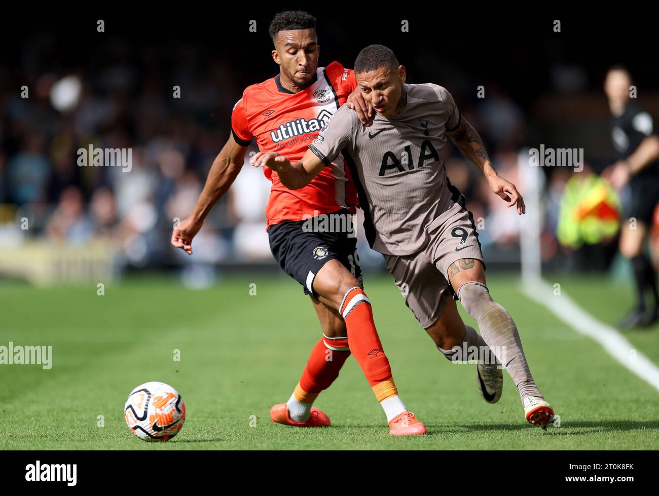 Luton Town's Jacob Brown (left) and Tottenham Hotspur's Richarlison ...