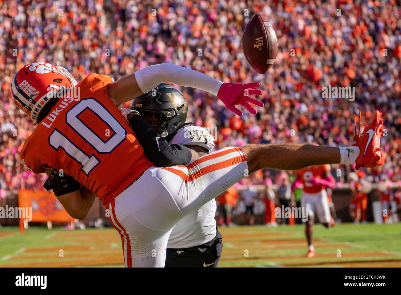 Clemson cornerback Jeadyn Lukus (10) breaks up a pass intended for Wake ...