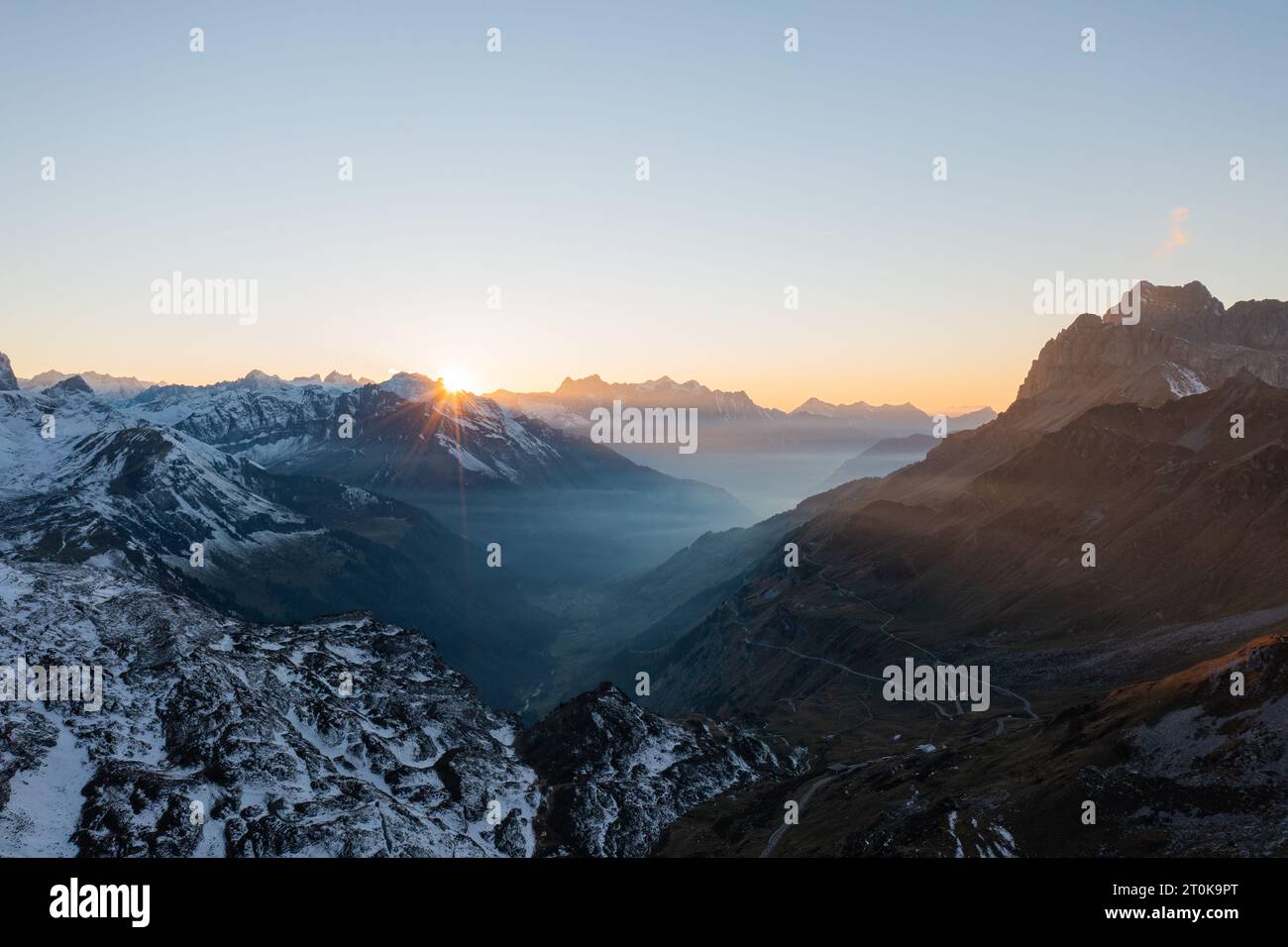 Great drone photo over the Swiss Alps at an epic sunrise with a pink ...