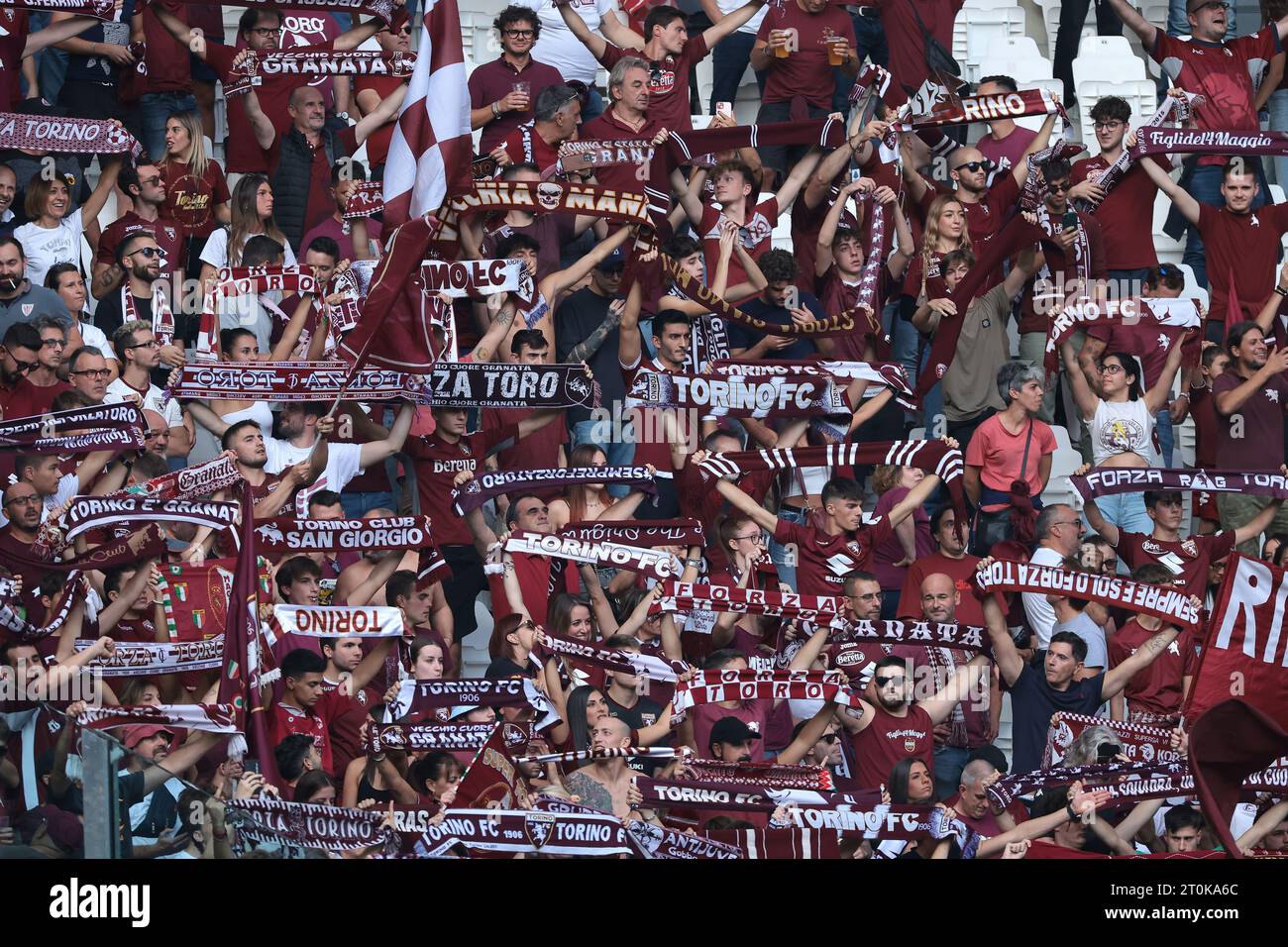 Turin, Italy. 7th Oct, 2023. Torino FC fans hold aloft their scarves as ...
