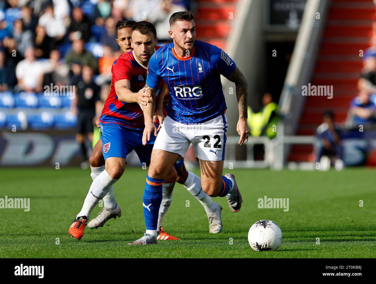 Brennan Dickenson of Oldham Athletic Association Football Club tussles ...
