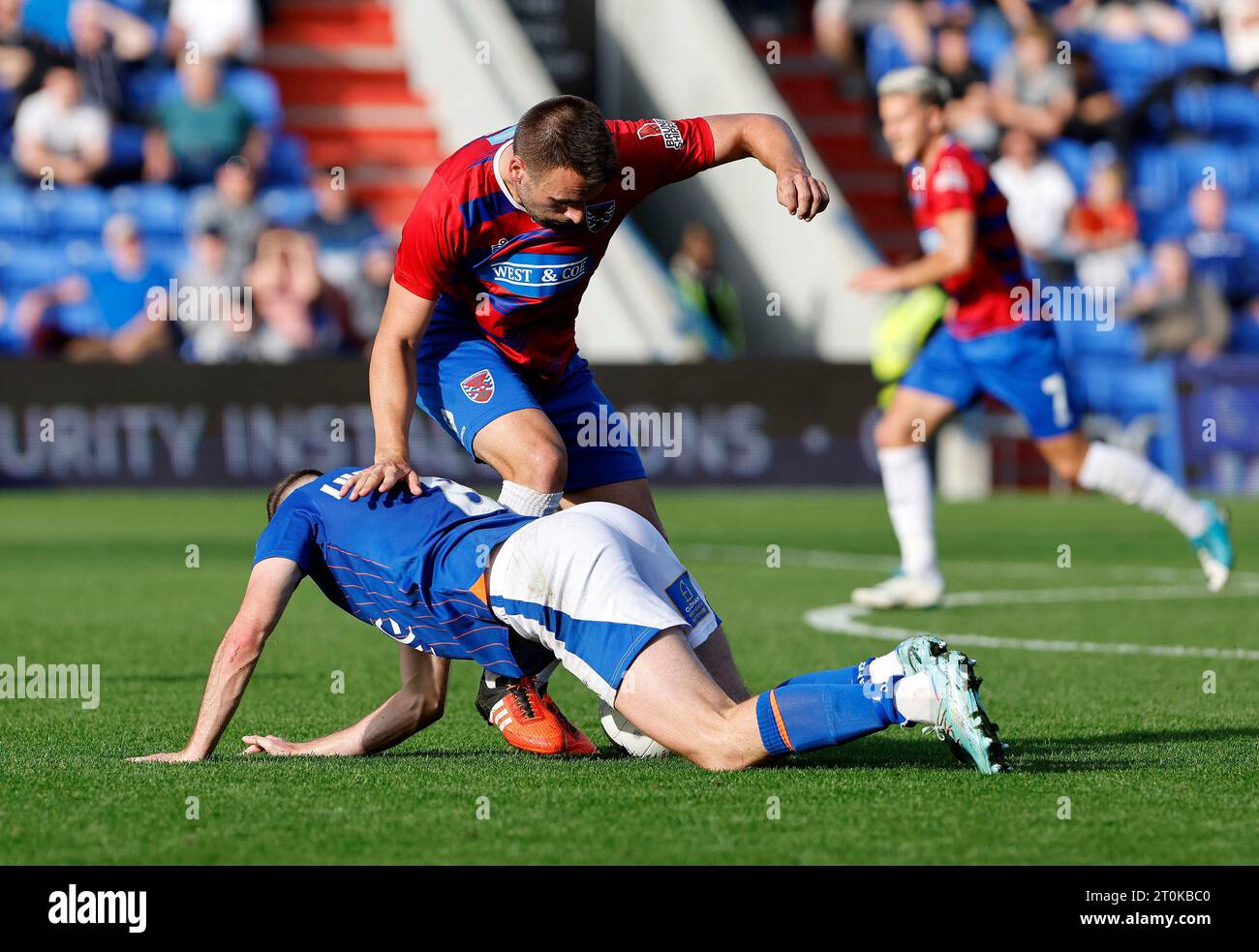 Josh Lundstram of Oldham Athletic Association Football Club tussles ...