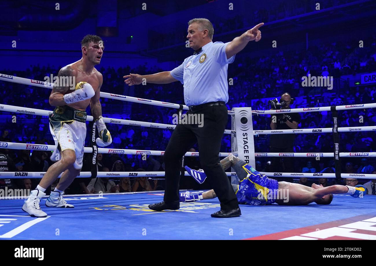 Leigh Wood (left) reacts after knocking down Josh Warrington to claim victory by TKO in their ...