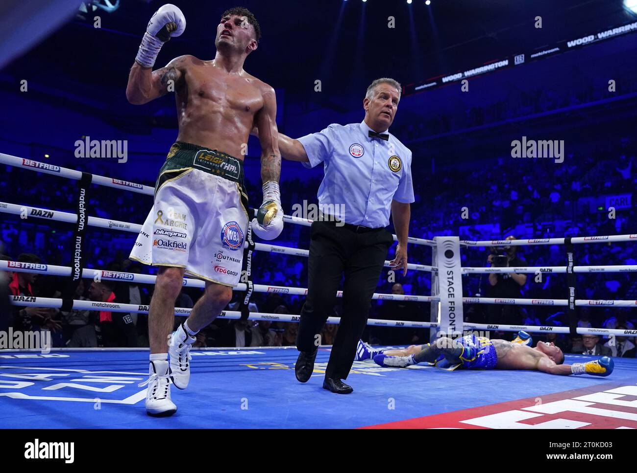 Leigh Wood (left) reacts after knocking down Josh Warrington to claim victory by TKO in their ...