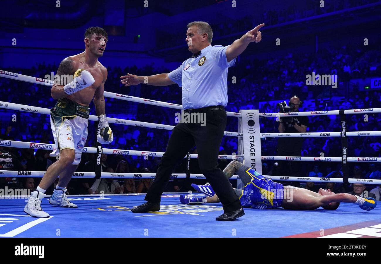 Leigh Wood (left) reacts after knocking down Josh Warrington to claim victory by TKO in their ...
